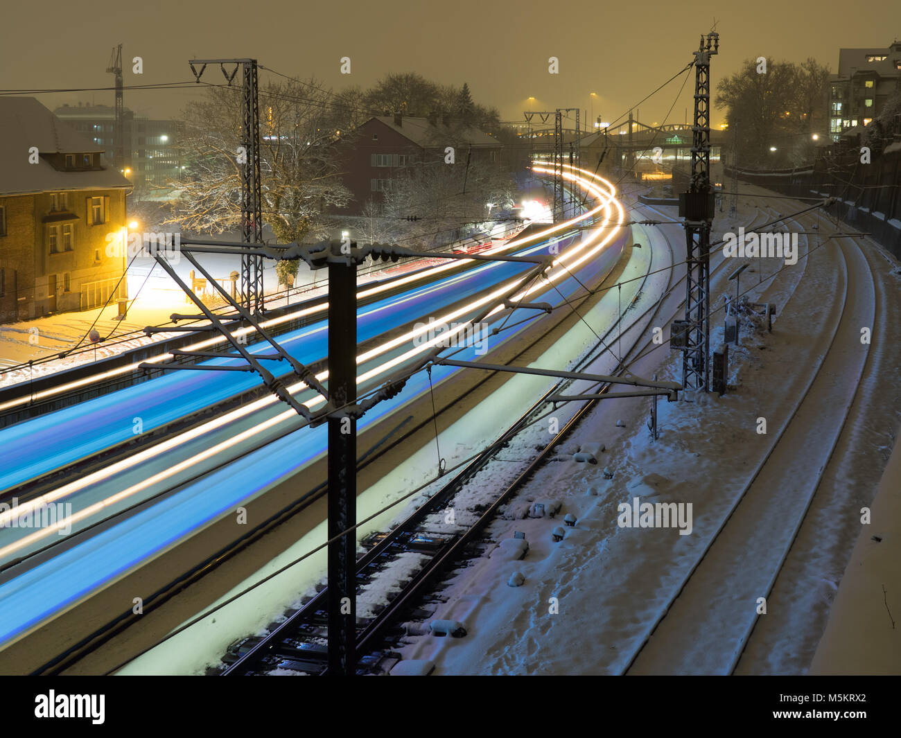 Light trail of a train at night in winter Stock Photo - Alamy