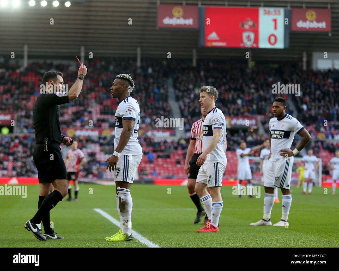 Referee Tim Robinson gives Middlesbrough's Adama Traore a red card ...