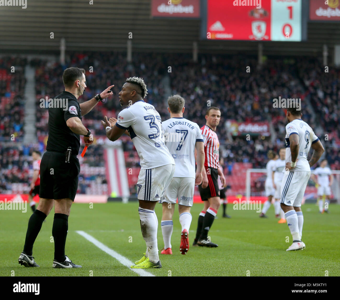 Referee Tim Robinson gives Middlesbrough's Adama Traore a red card ...