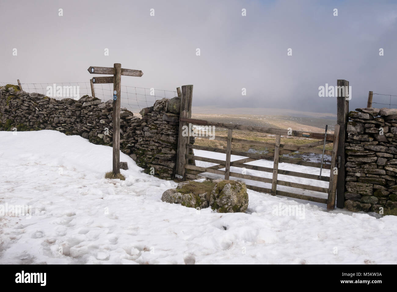 Signpost showing where the path splits between the route to Malham and ...
