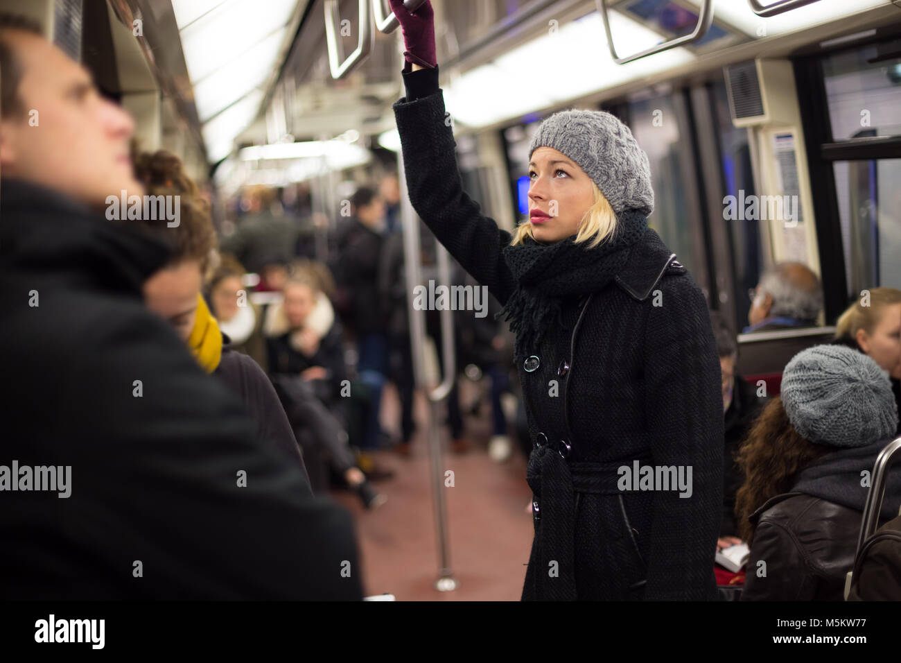 Woman on subway Stock Photo - Alamy