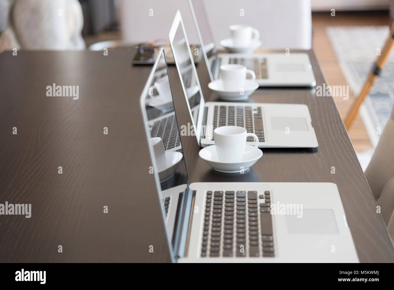 Multiple computers with coffee in a office environment side of ...