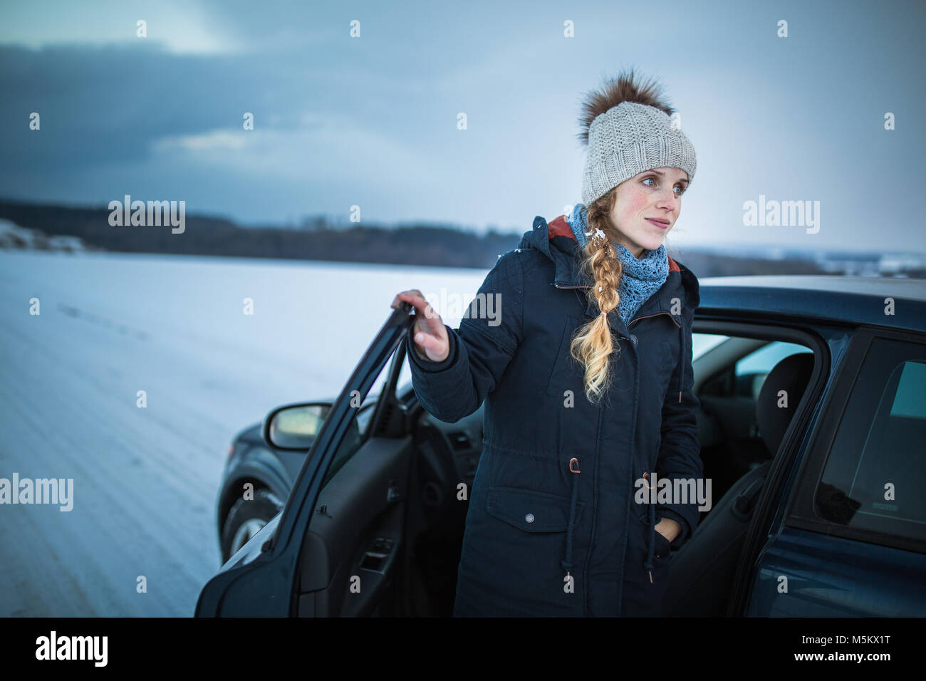 Woman driving a car - female driver at a wheel of a modern car, looking ...