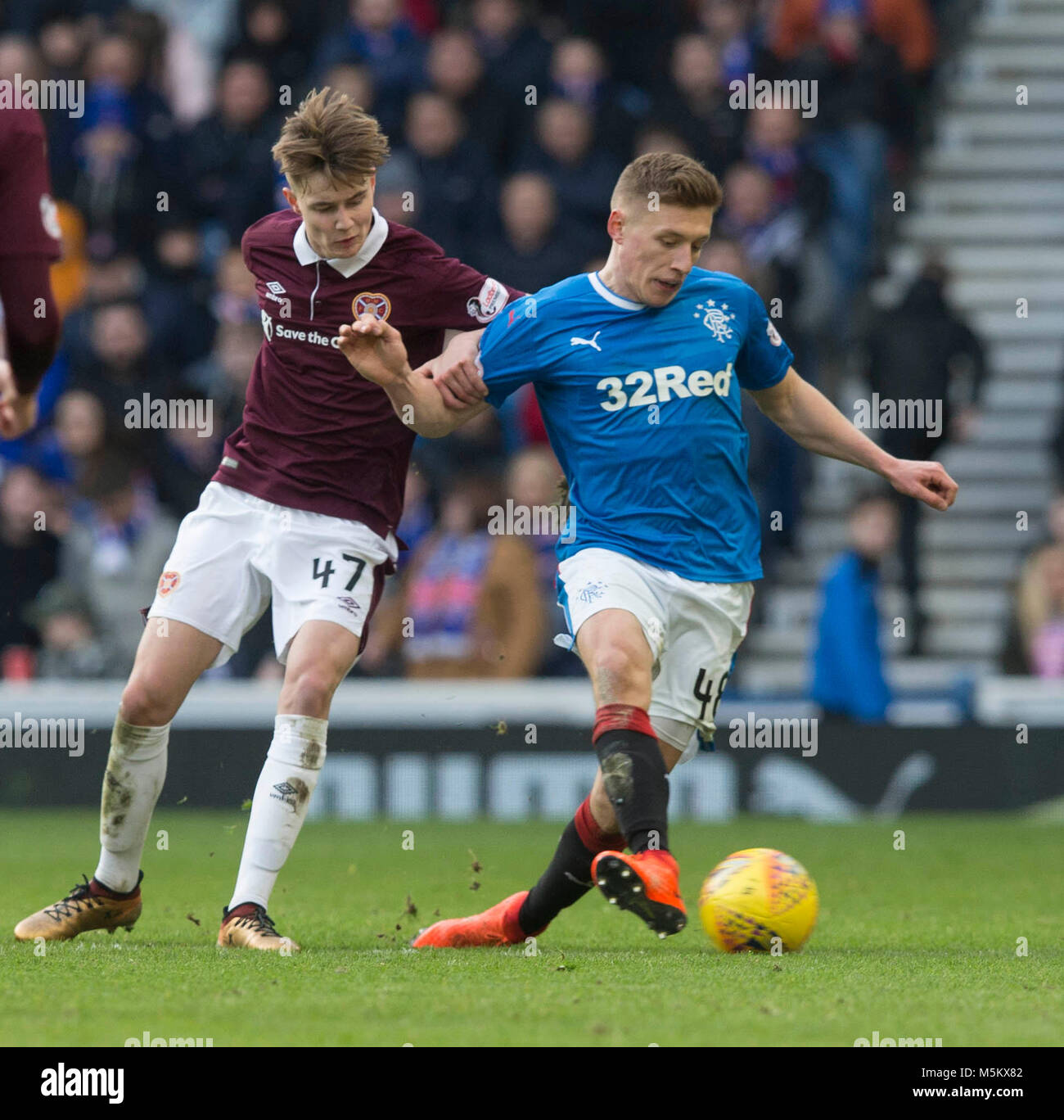 Rangers Greg Docherty (right) and Hearts' Harry Cochrane (left) battle ...