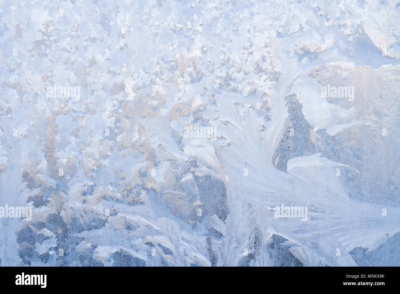 Winter frosty patterns on the frozen ice window Stock Photo - Alamy