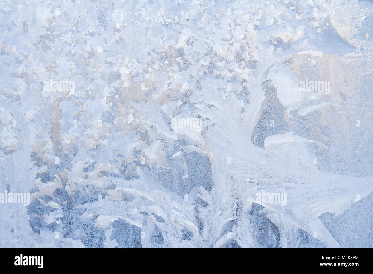 Winter frosty patterns on the frozen ice window Stock Photo - Alamy