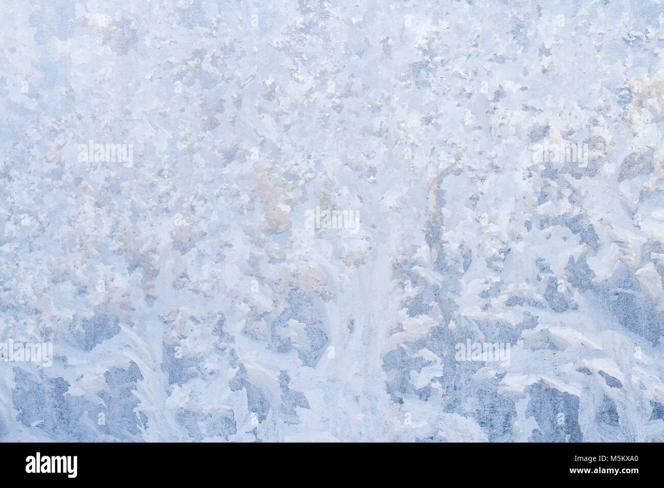 Winter frosty patterns on the frozen ice window Stock Photo - Alamy