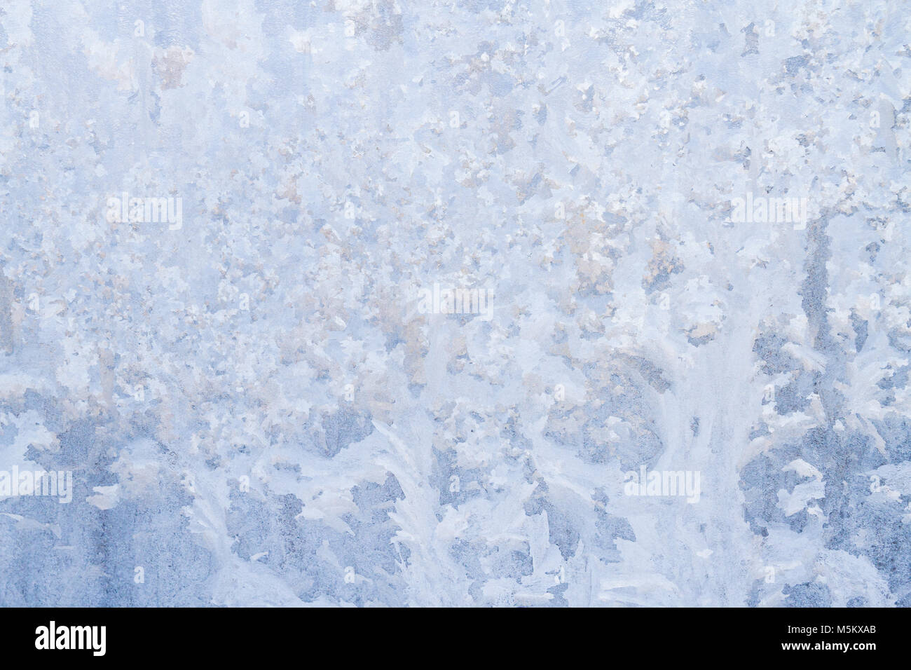 Winter frosty patterns on the frozen ice window Stock Photo - Alamy