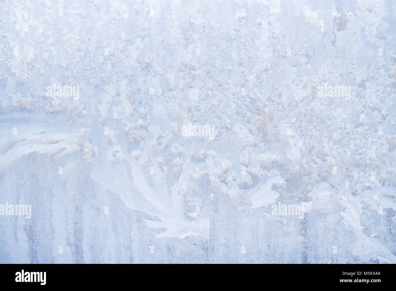 Winter frosty patterns on the frozen ice window Stock Photo - Alamy