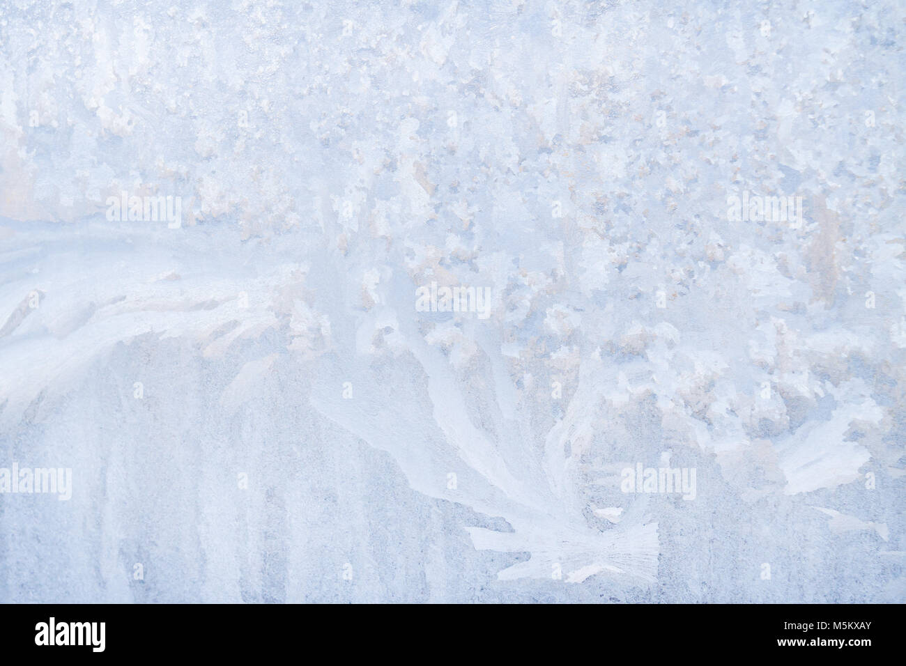 Winter frosty patterns on the frozen ice window Stock Photo - Alamy