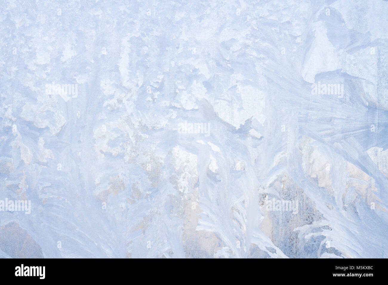 Winter frosty patterns on the frozen ice window Stock Photo - Alamy