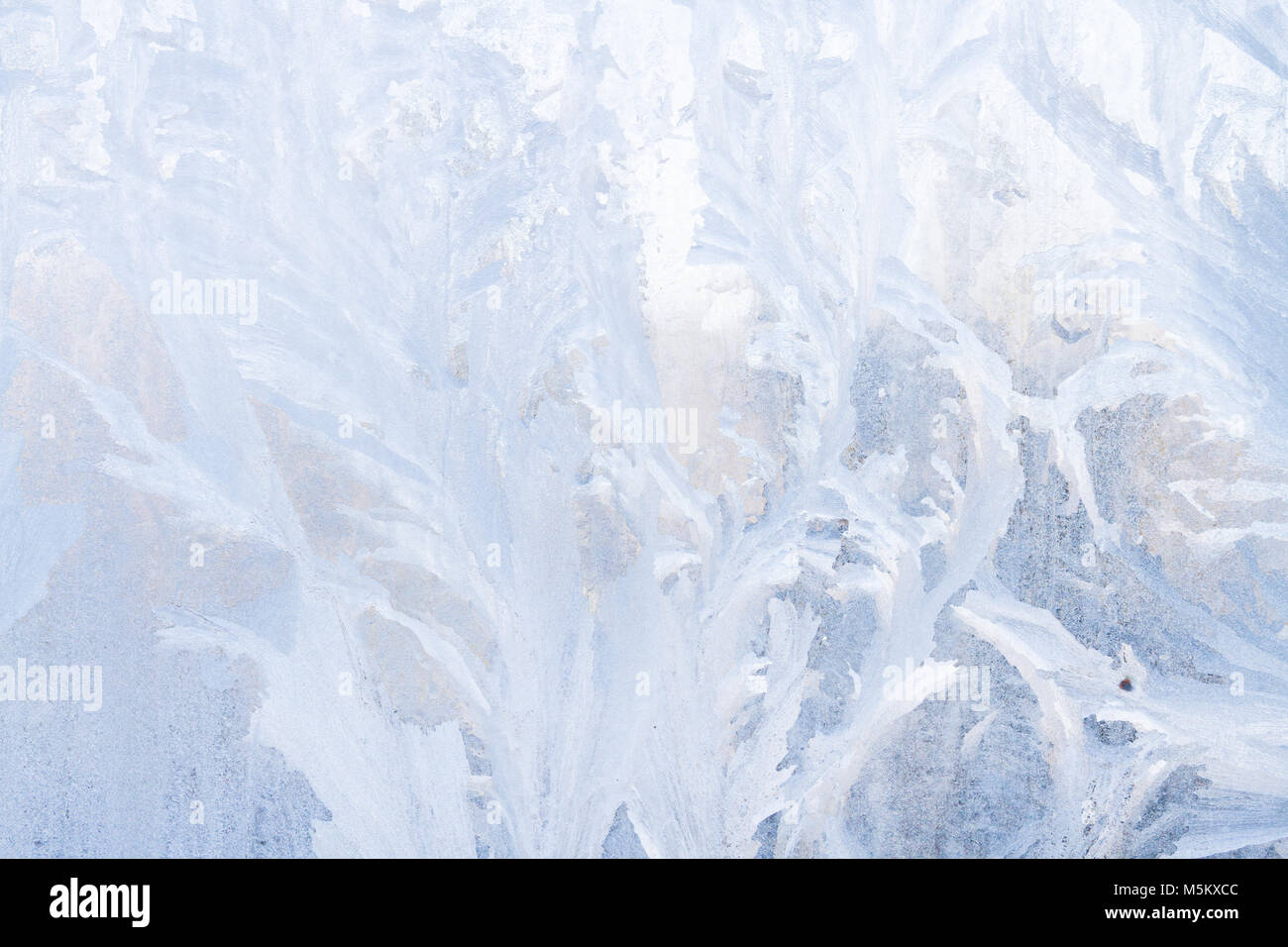 Winter frosty patterns on the frozen ice window Stock Photo - Alamy
