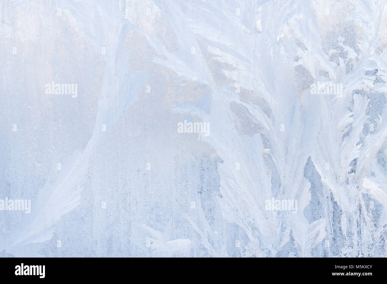 Winter frosty patterns on the frozen ice window Stock Photo - Alamy