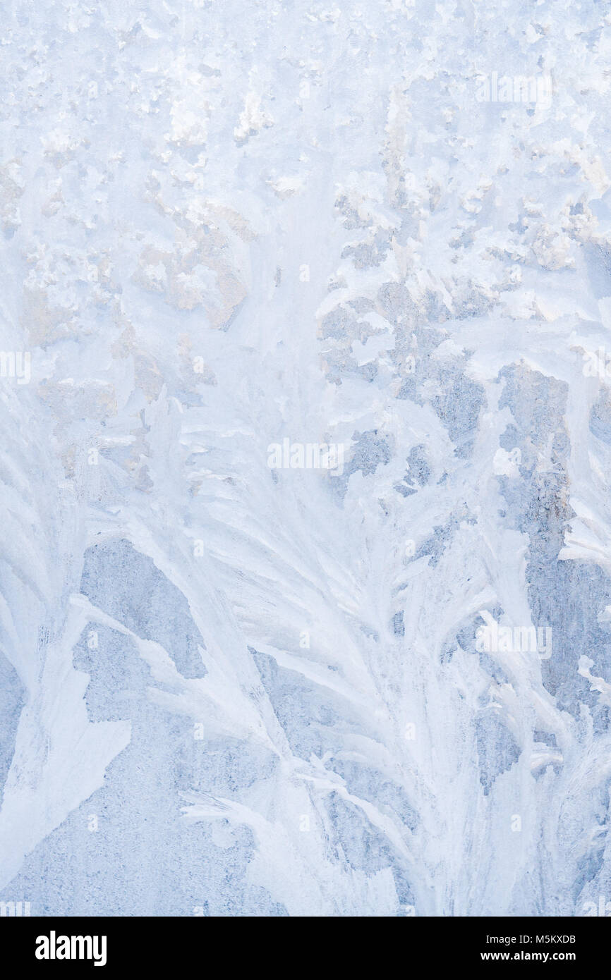 Winter frosty patterns on the frozen ice window Stock Photo - Alamy