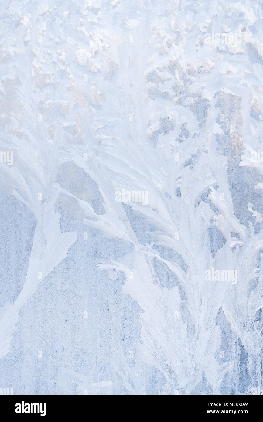 Winter frosty patterns on the frozen ice window Stock Photo - Alamy
