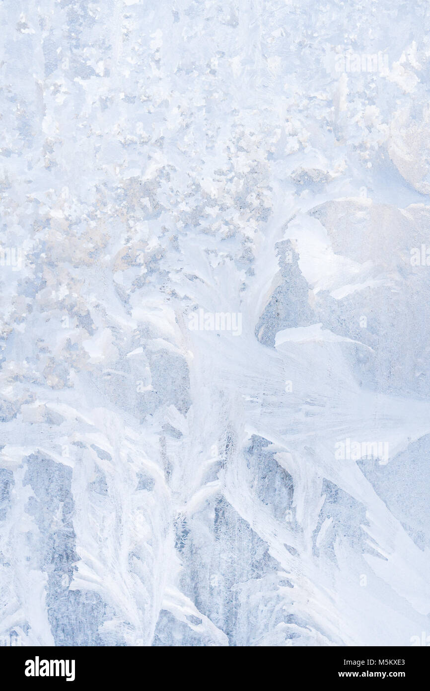 Winter frosty patterns on the frozen ice window Stock Photo - Alamy
