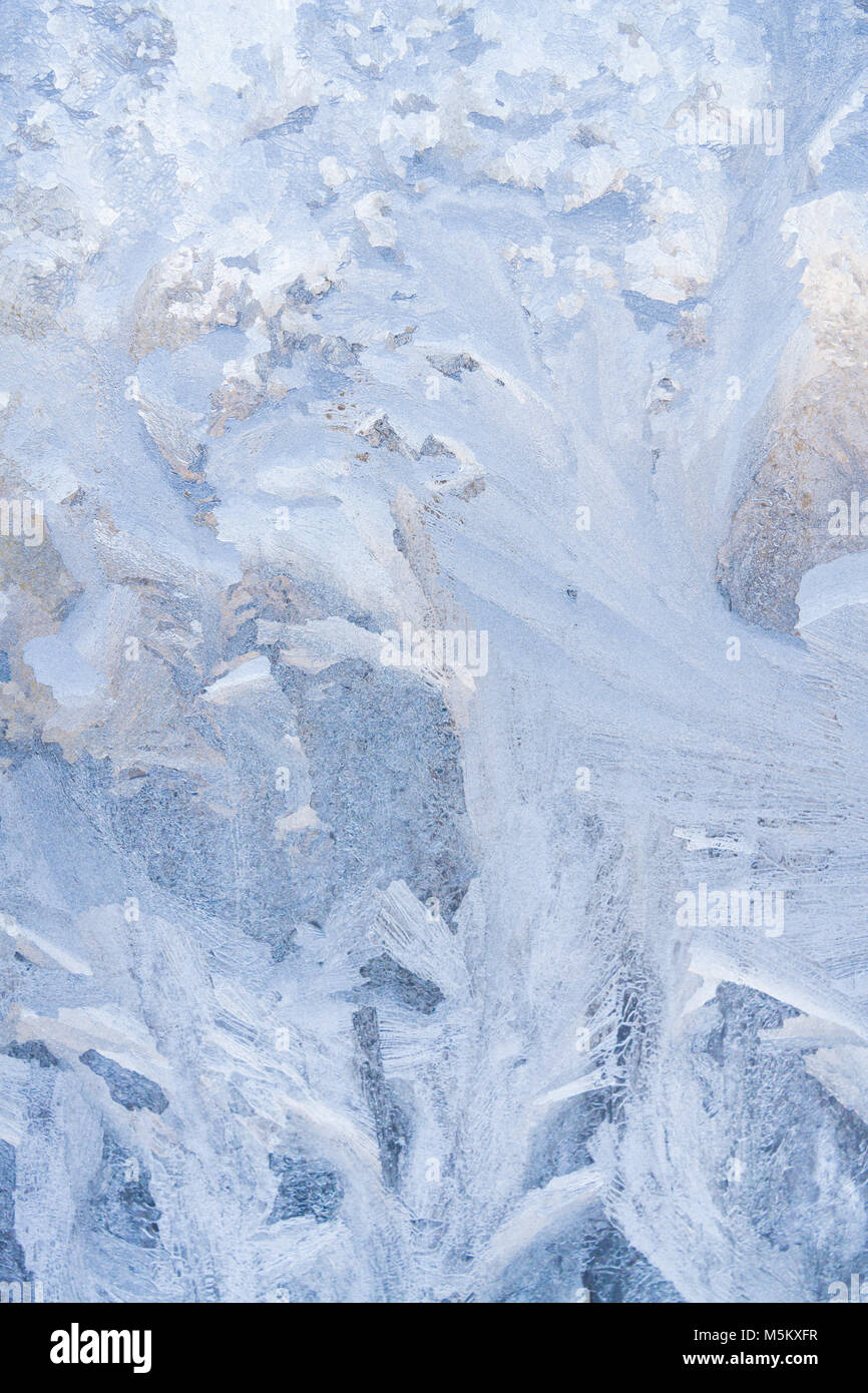 Winter frosty patterns on the frozen ice window Stock Photo - Alamy