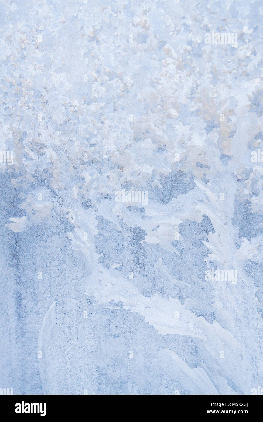 Winter frosty patterns on the frozen ice window Stock Photo - Alamy