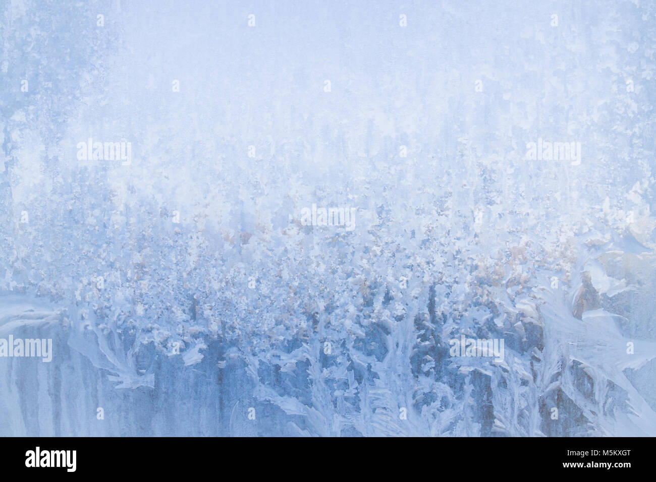 Winter frosty patterns on the frozen ice window Stock Photo - Alamy