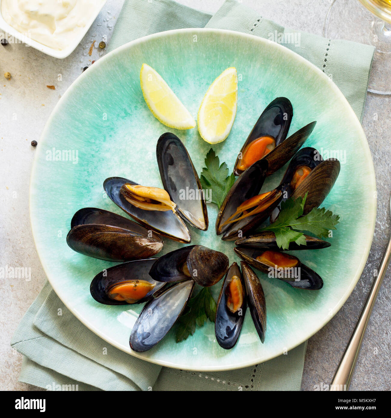 Still life, restaurant dinner. boiled in white wine sauce with a glass ...