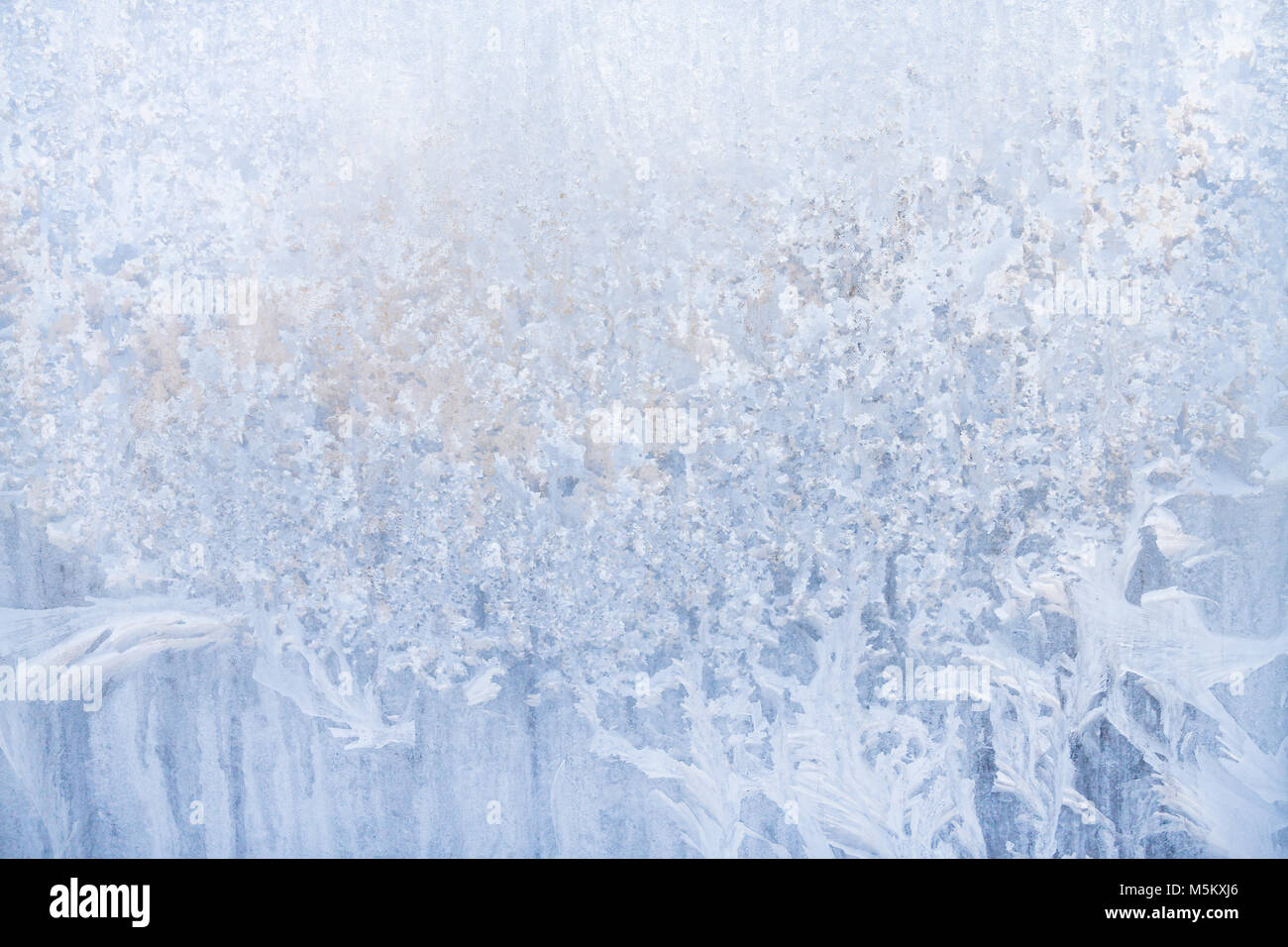 Winter frosty patterns on the frozen ice window Stock Photo - Alamy