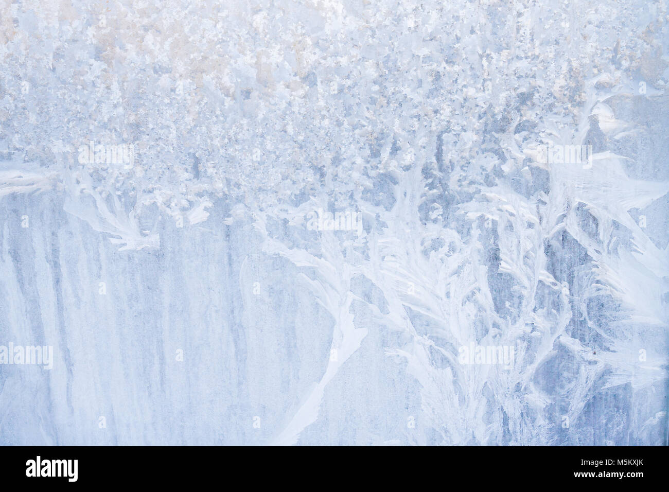 Winter frosty patterns on the frozen ice window Stock Photo - Alamy