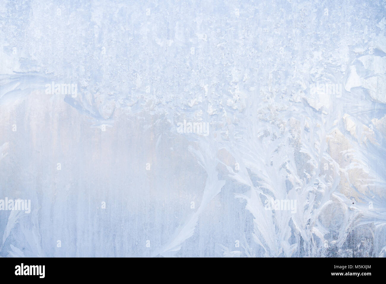 Winter frosty patterns on the frozen ice window Stock Photo - Alamy
