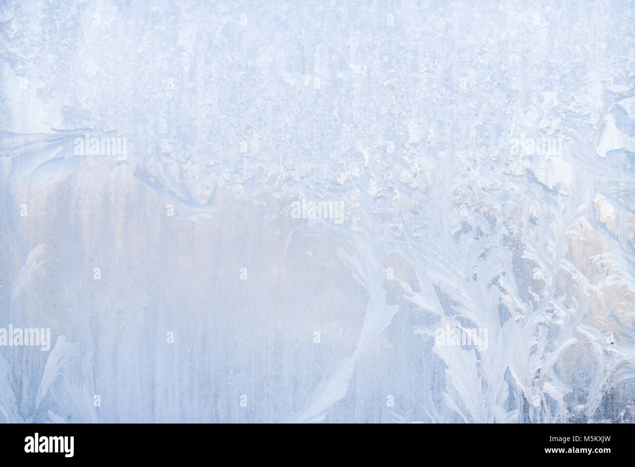 Winter frosty patterns on the frozen ice window Stock Photo - Alamy