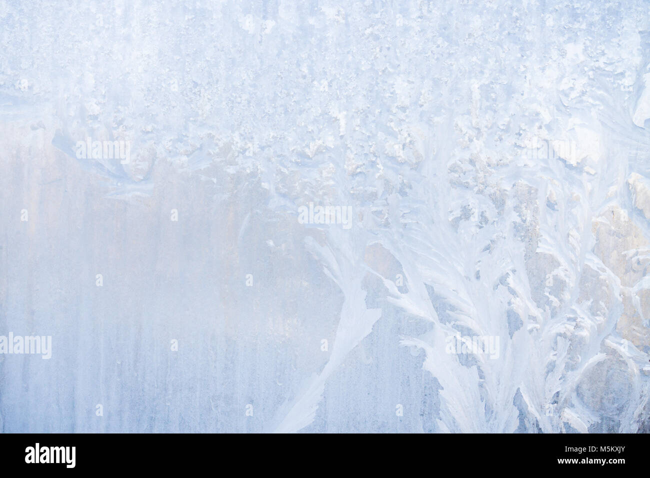 Winter frosty patterns on the frozen ice window Stock Photo - Alamy