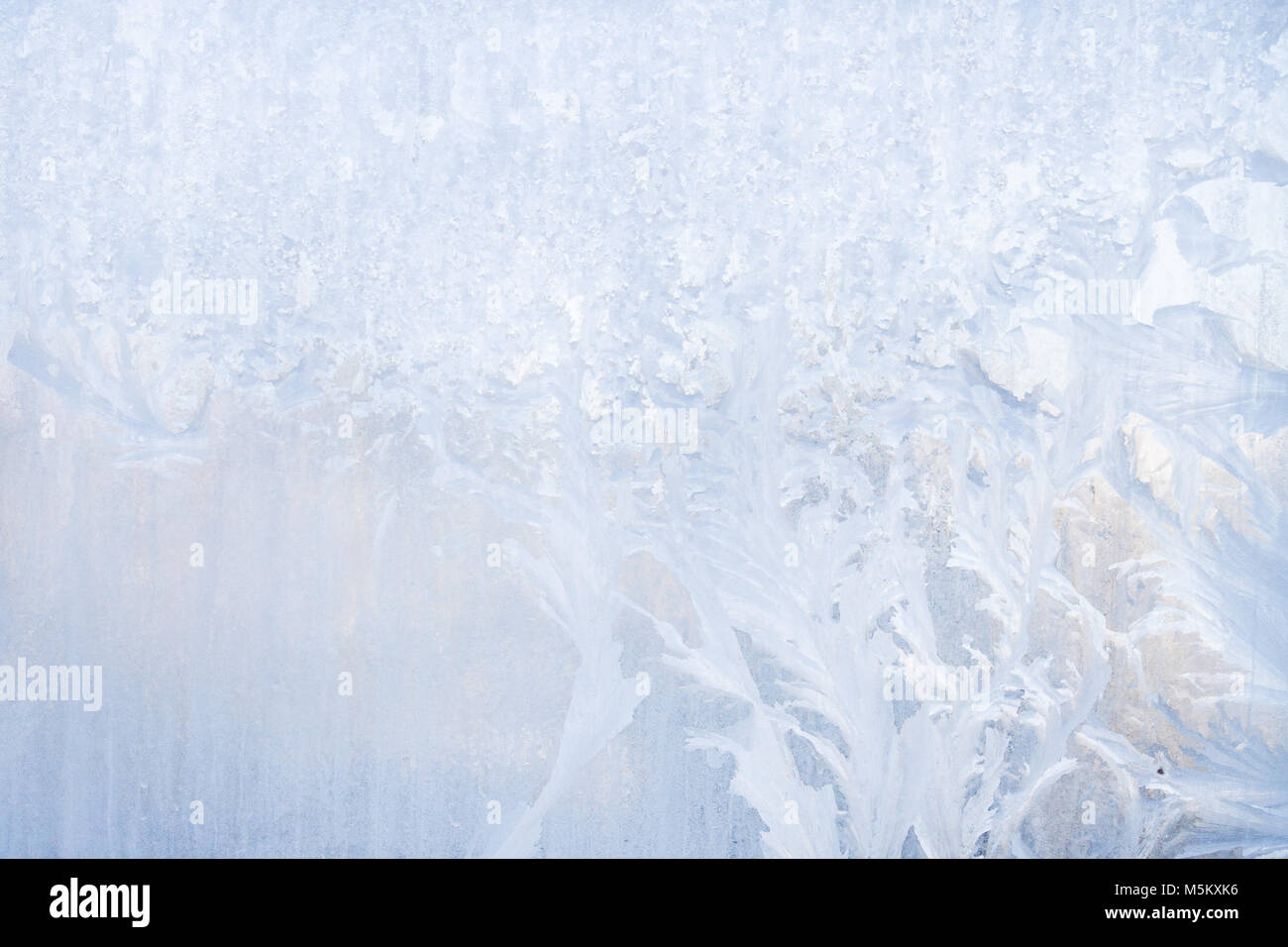 Winter frosty patterns on the frozen ice window Stock Photo - Alamy
