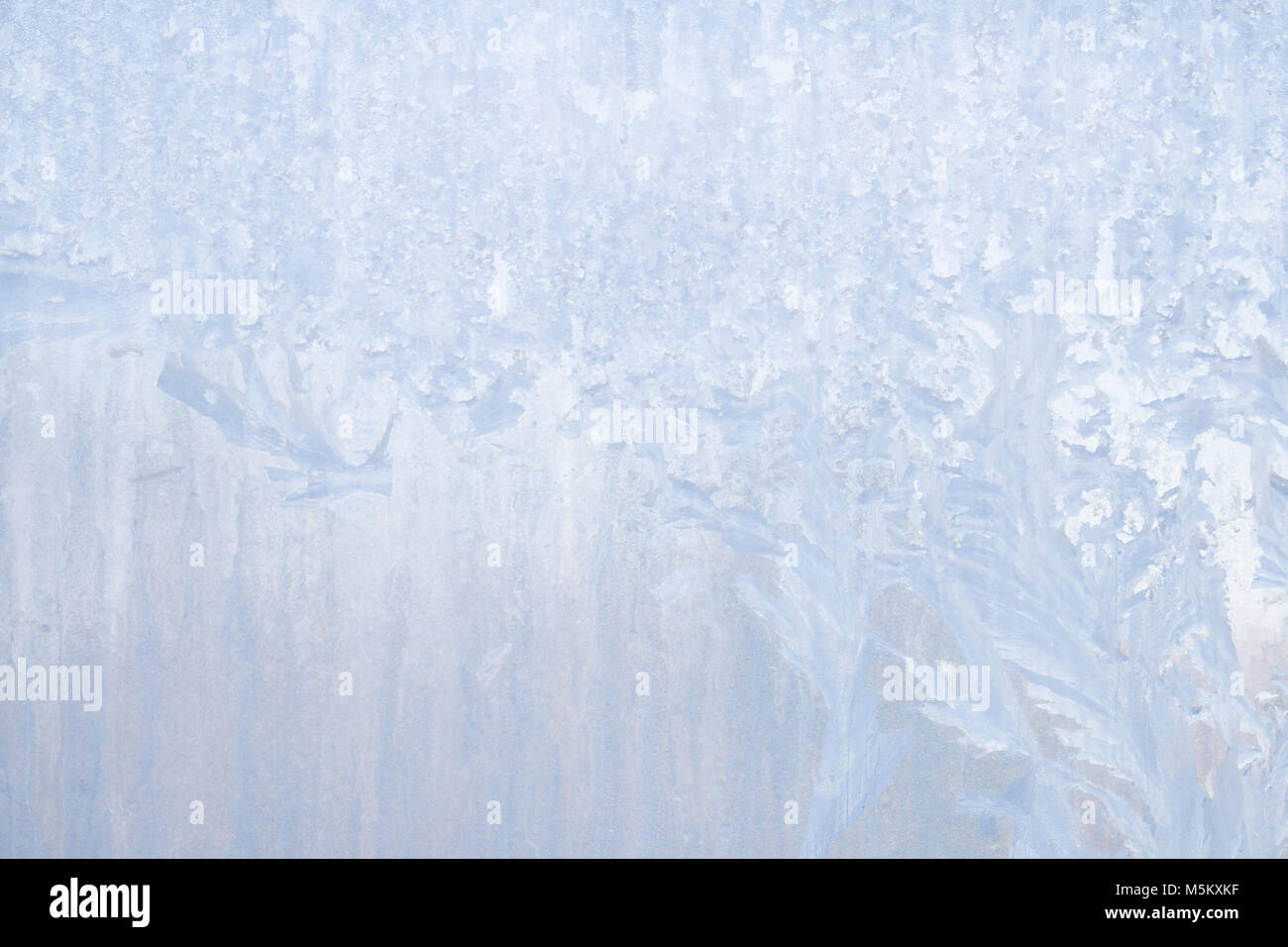 Winter frosty patterns on the frozen ice window Stock Photo - Alamy