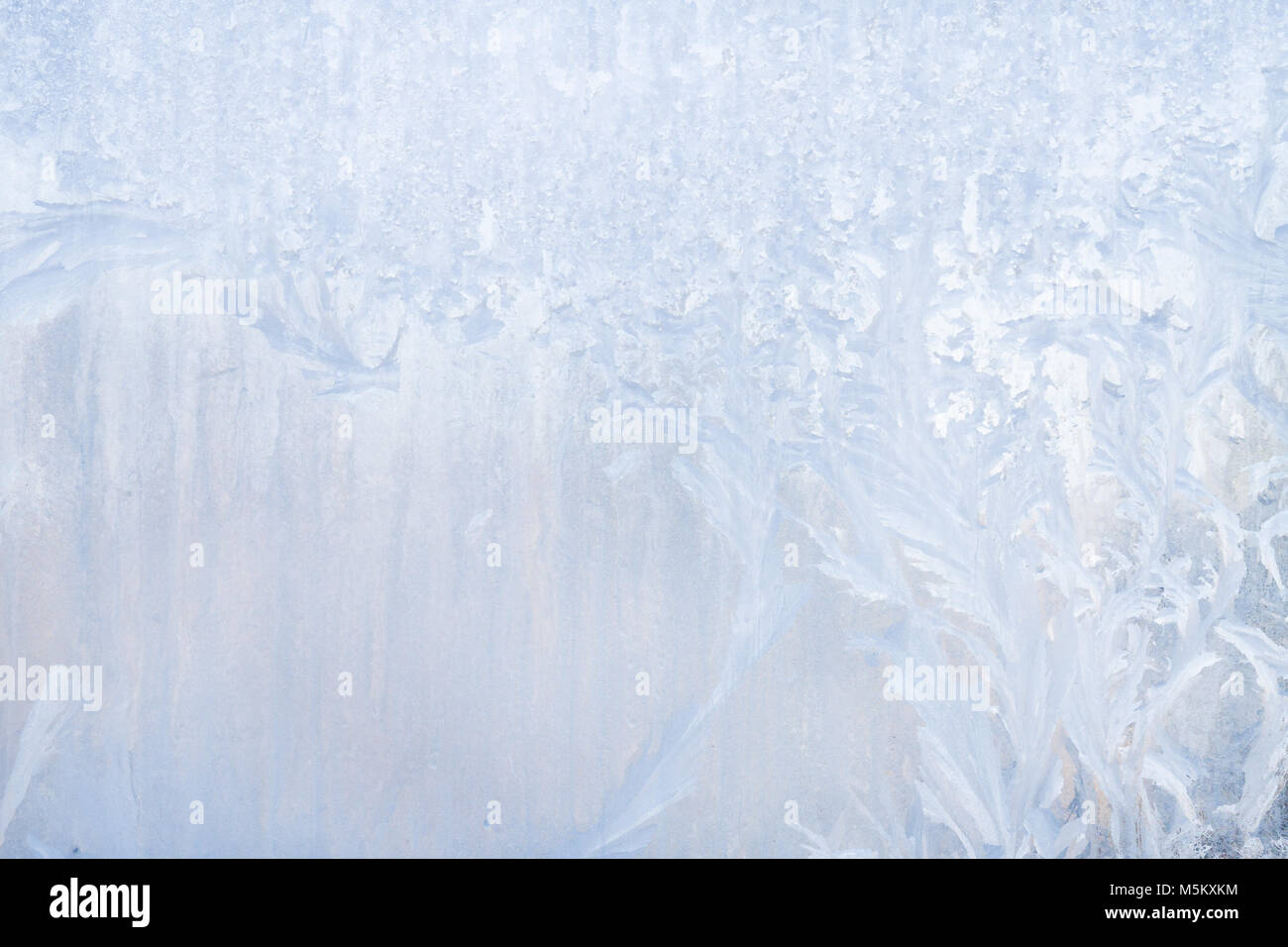 Winter frosty patterns on the frozen ice window Stock Photo - Alamy