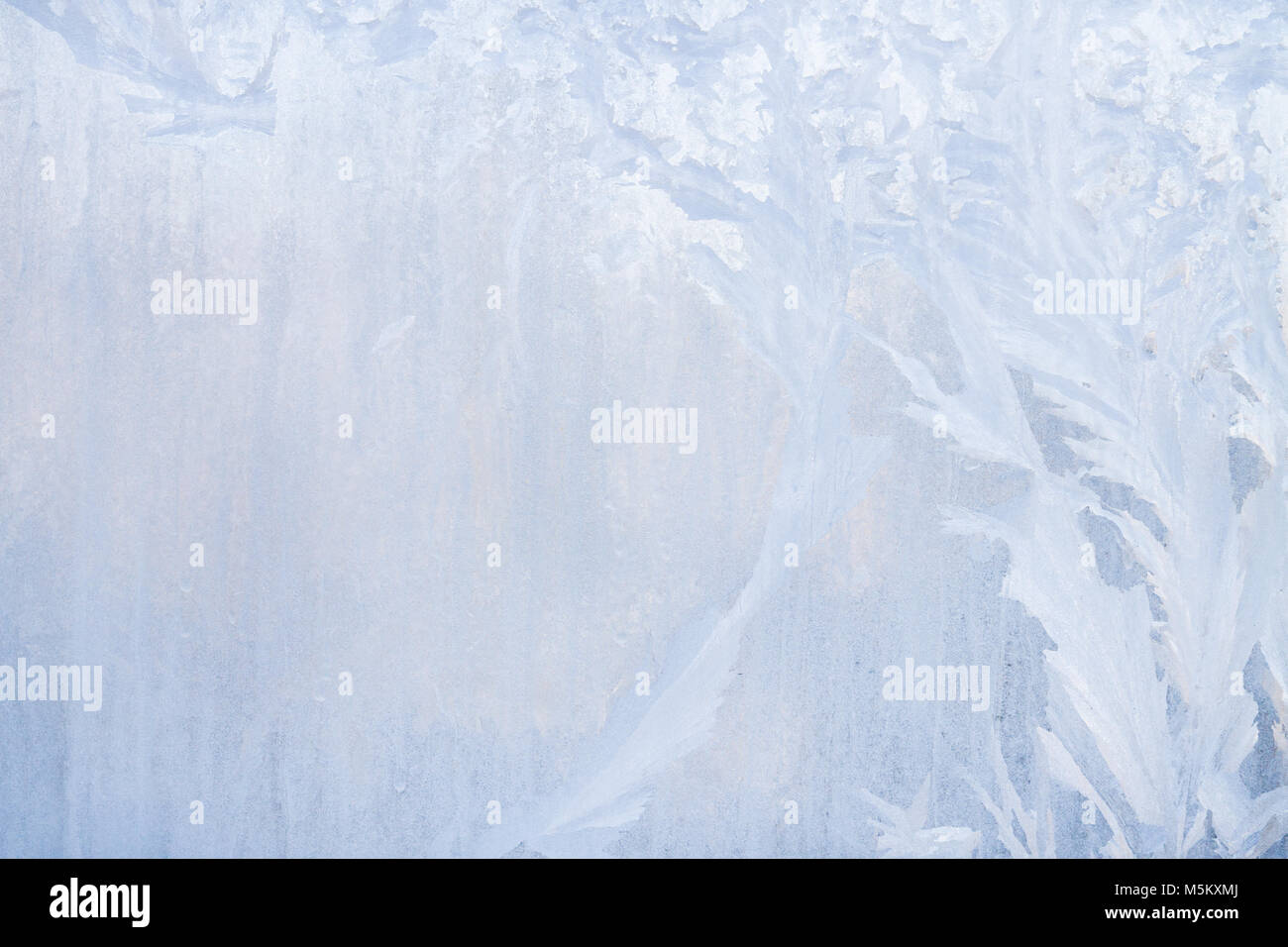 Winter frosty patterns on the frozen ice window Stock Photo - Alamy