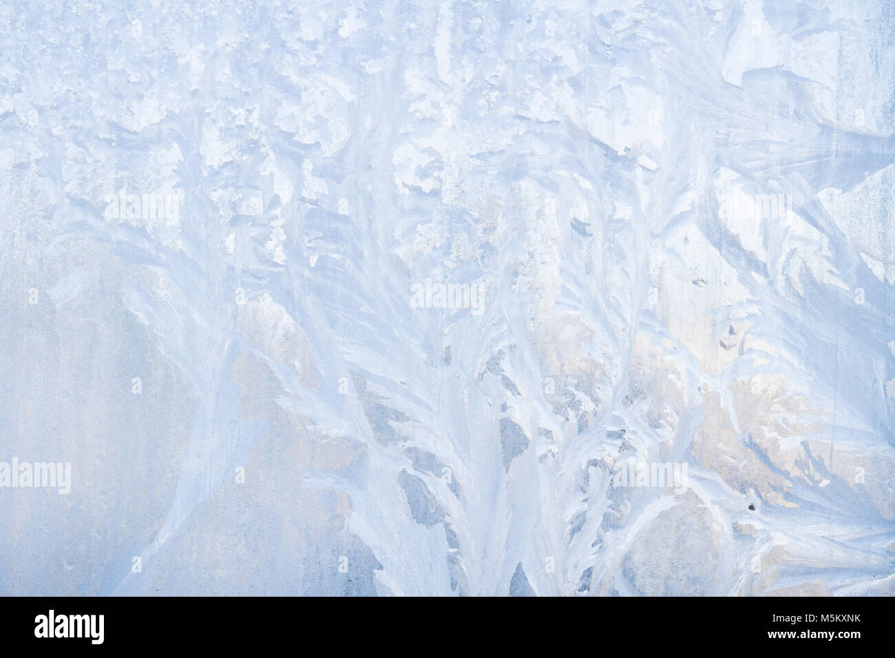 Winter frosty patterns on the frozen ice window Stock Photo - Alamy