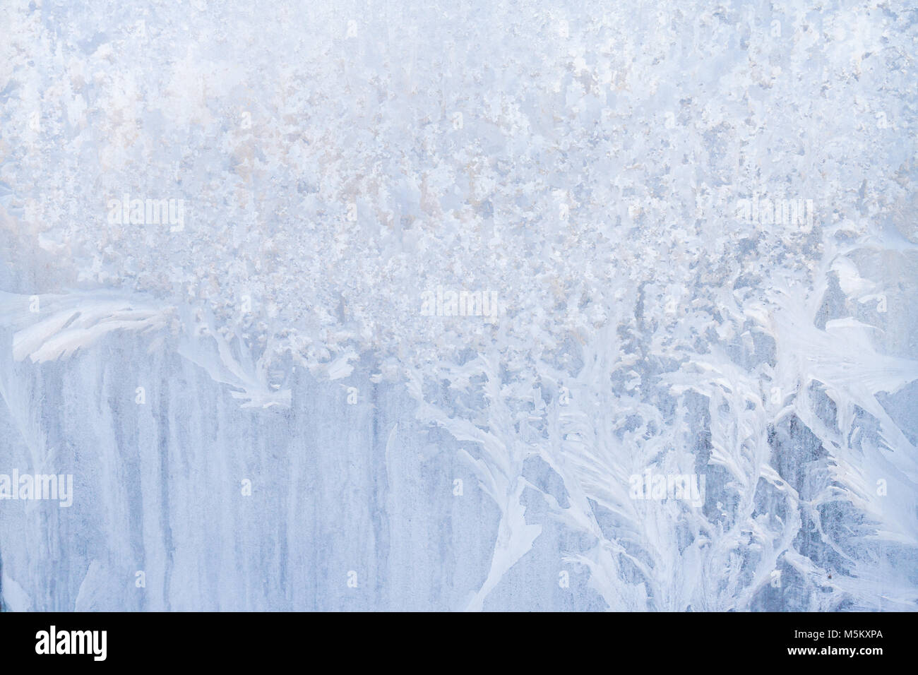 Winter frosty patterns on the frozen ice window Stock Photo - Alamy