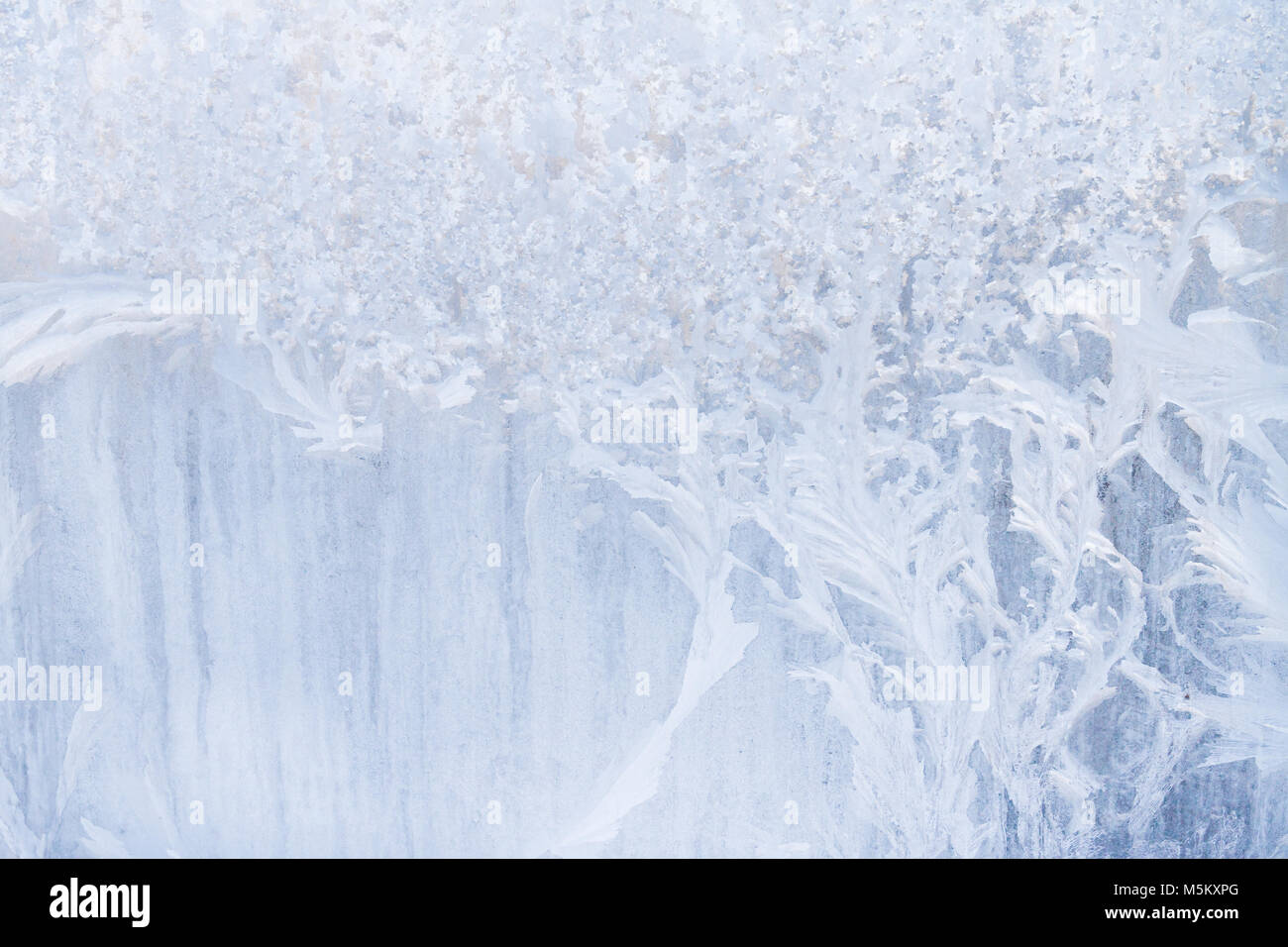 Winter frosty patterns on the frozen ice window Stock Photo - Alamy