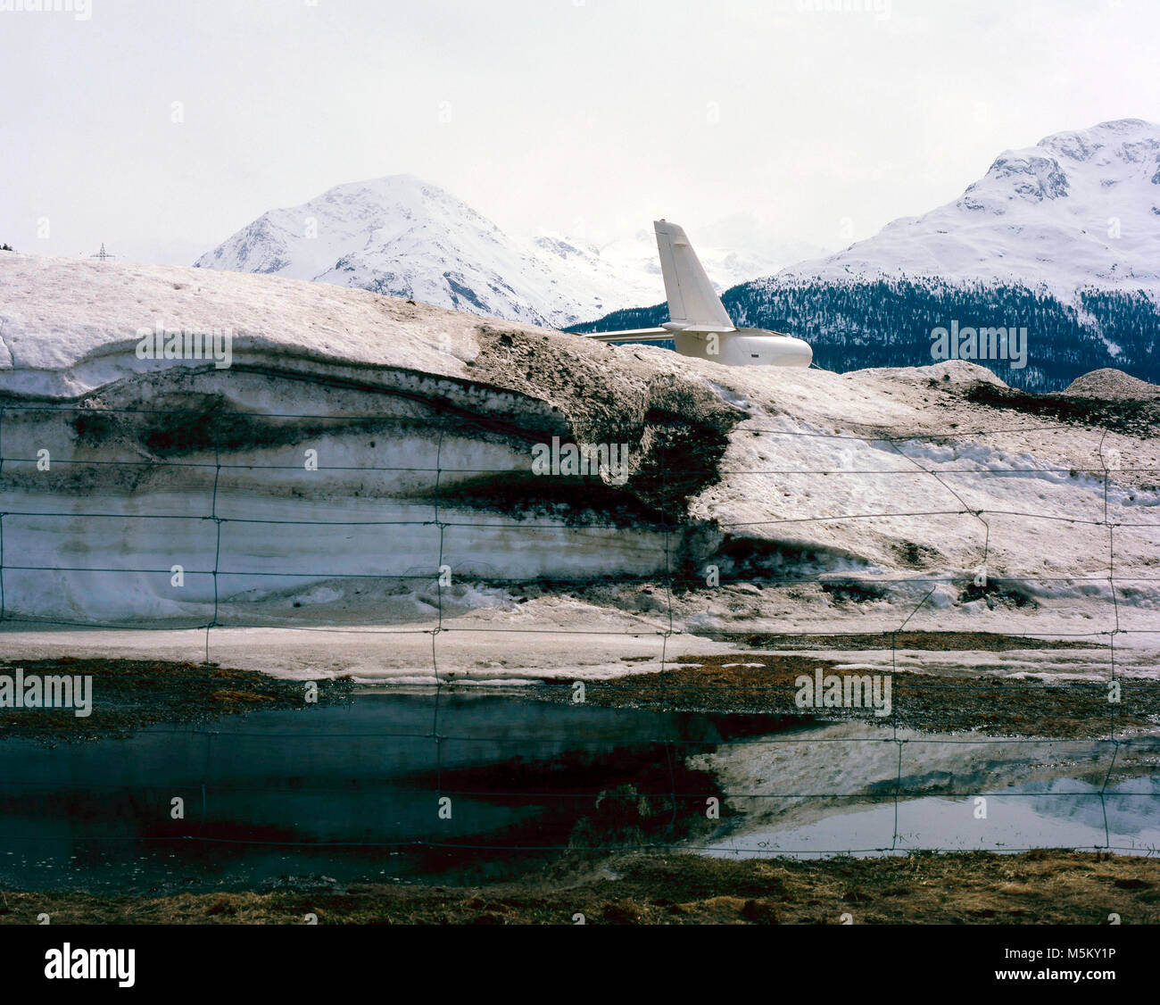 Private jets, airplanes and propeller type aircrafts in the snowy ...