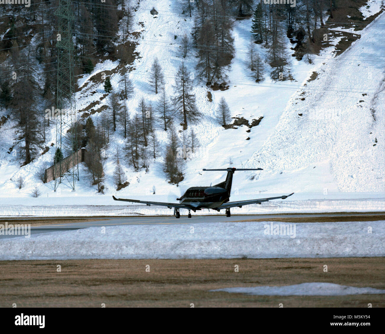 Private jets, airplanes and propeller type aircrafts in the snowy ...