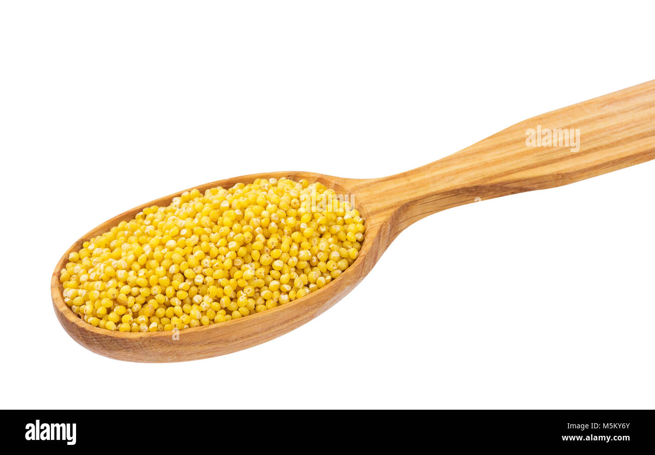 Millet in wooden spoon isolated on white Stock Photo - Alamy