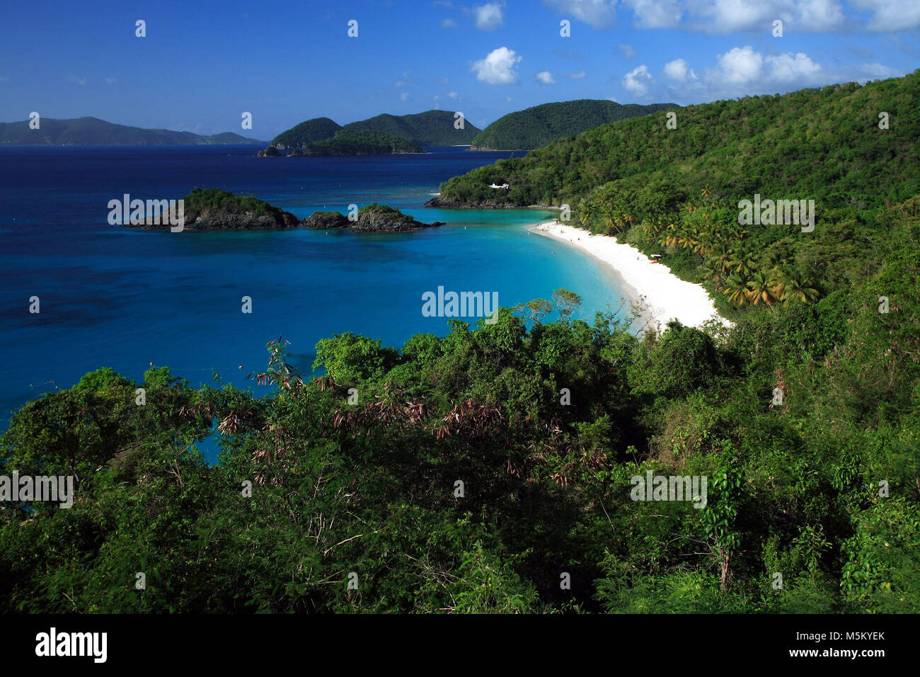 The calm waters of Trunk Bay help to make it the most visited beach on ...