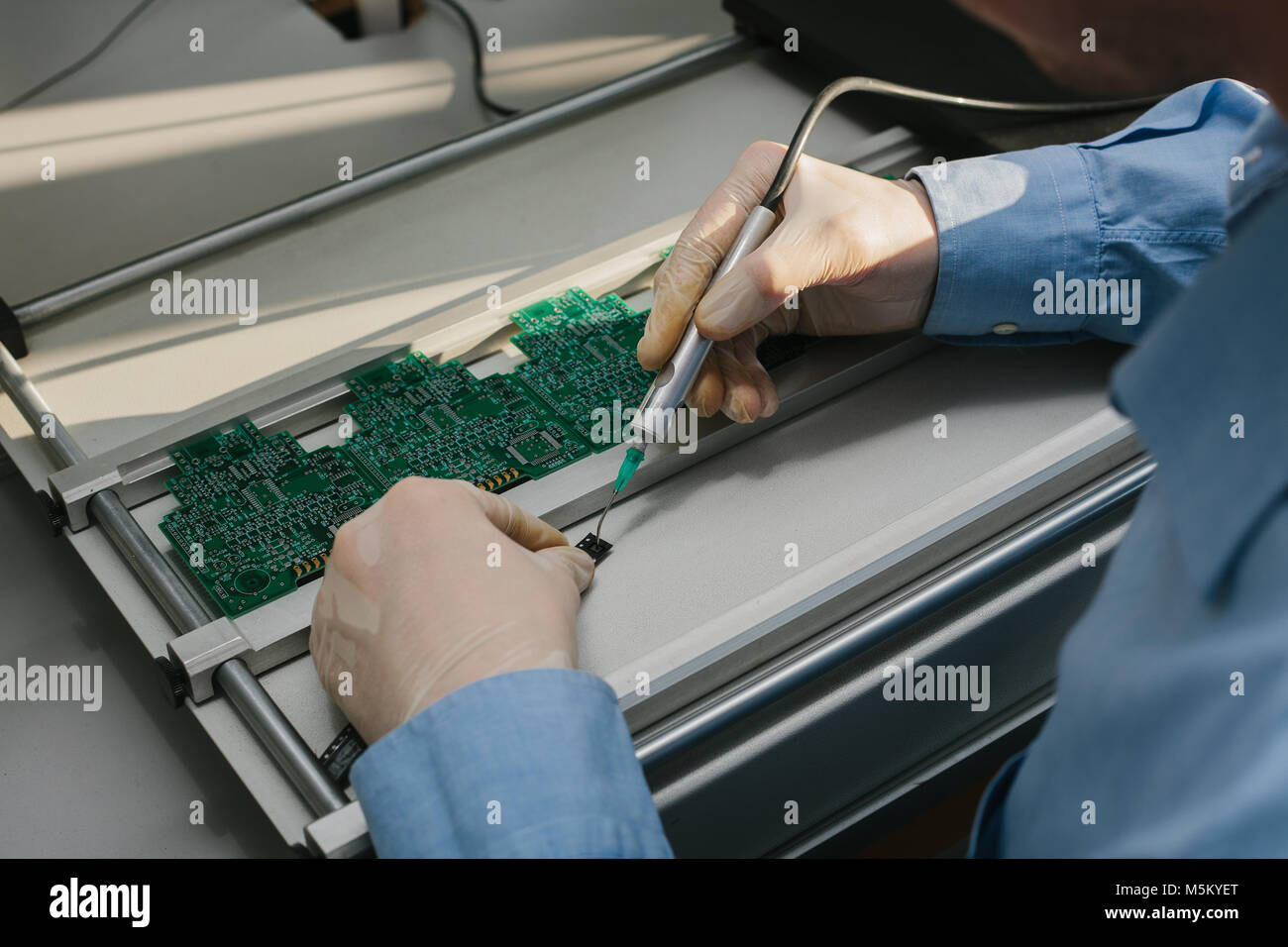 The assembly of computer units. Technological process Stock Photo - Alamy
