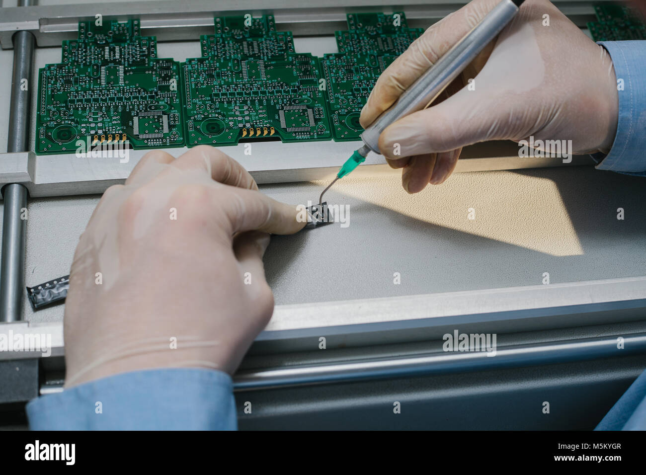 The assembly of computer units. Technological process Stock Photo - Alamy