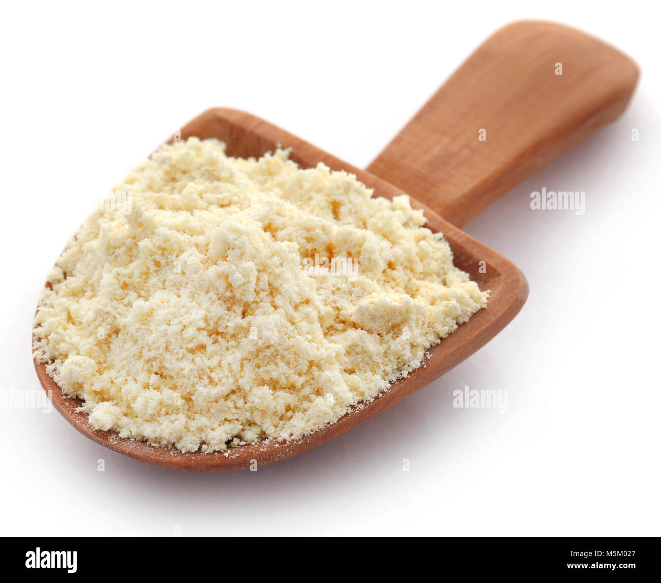 Gram flour in wooden scoop over white background Stock Photo - Alamy