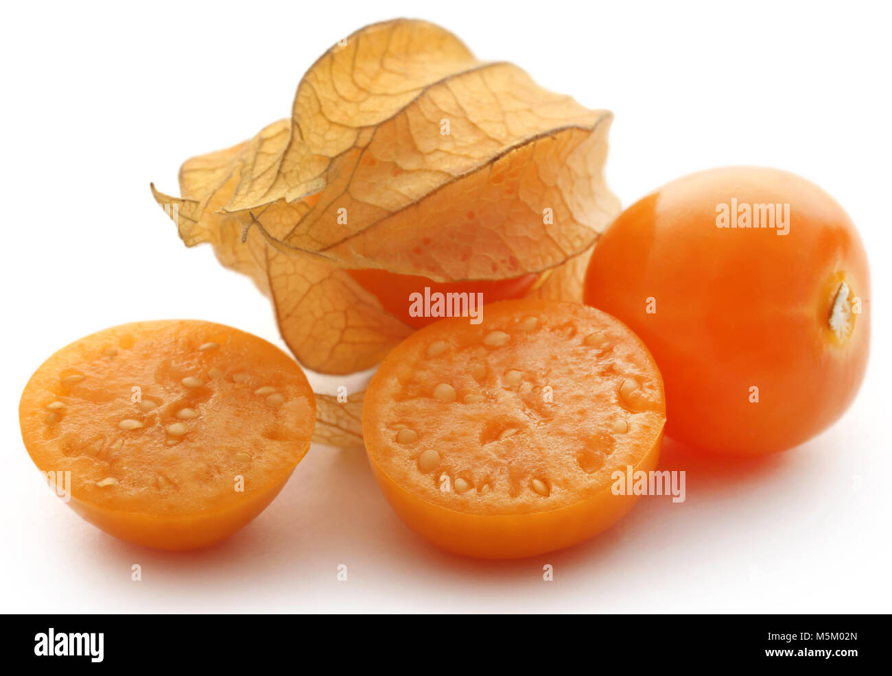Fresh edible physalis over white background Stock Photo - Alamy