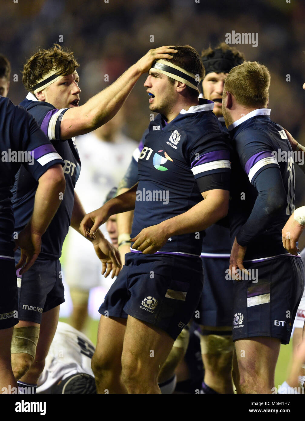 Scotland's Stuart McInally (centre) is congratulated by team mate ...
