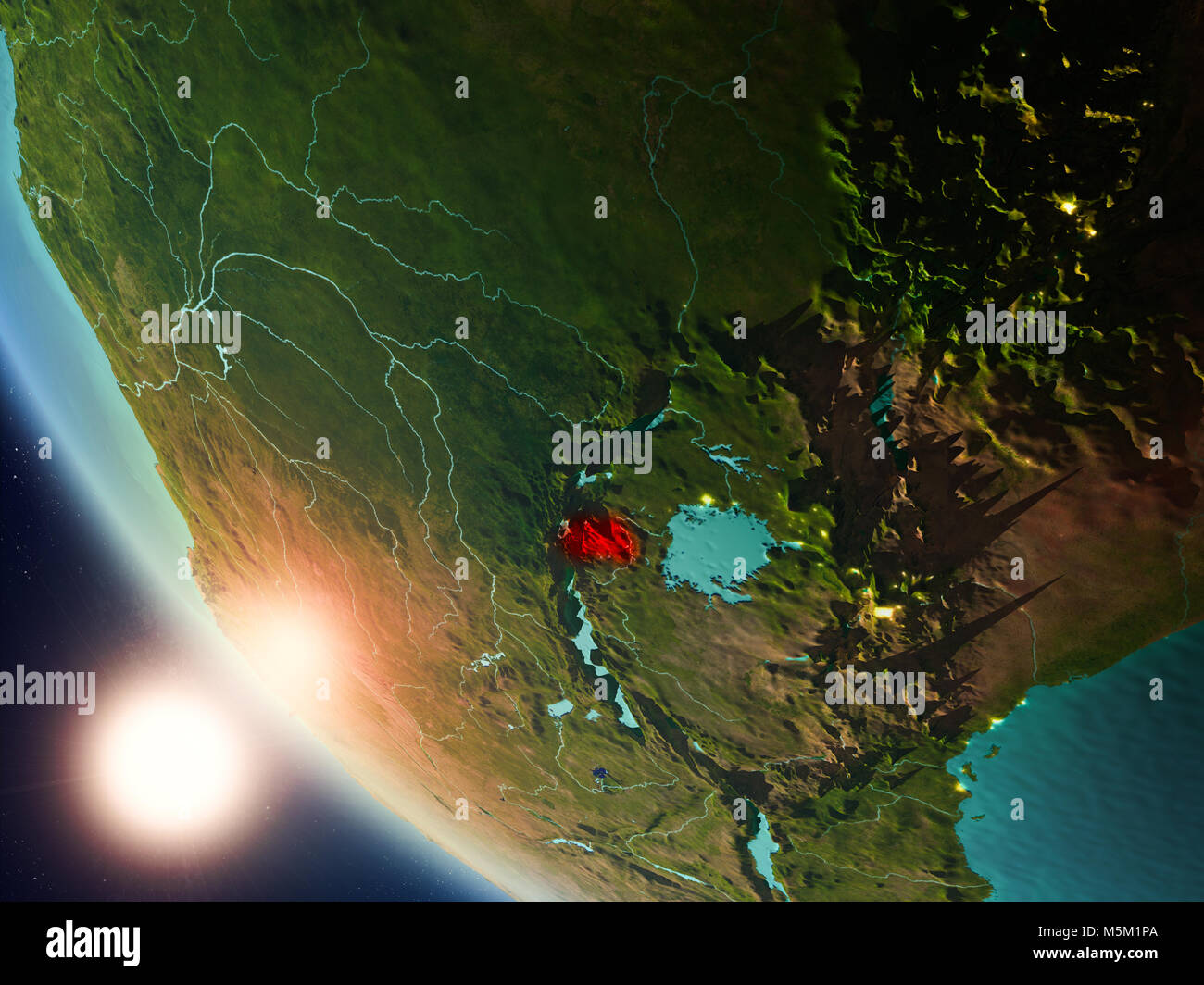 Satellite view of Rwanda highlighted in red on planet Earth with ...