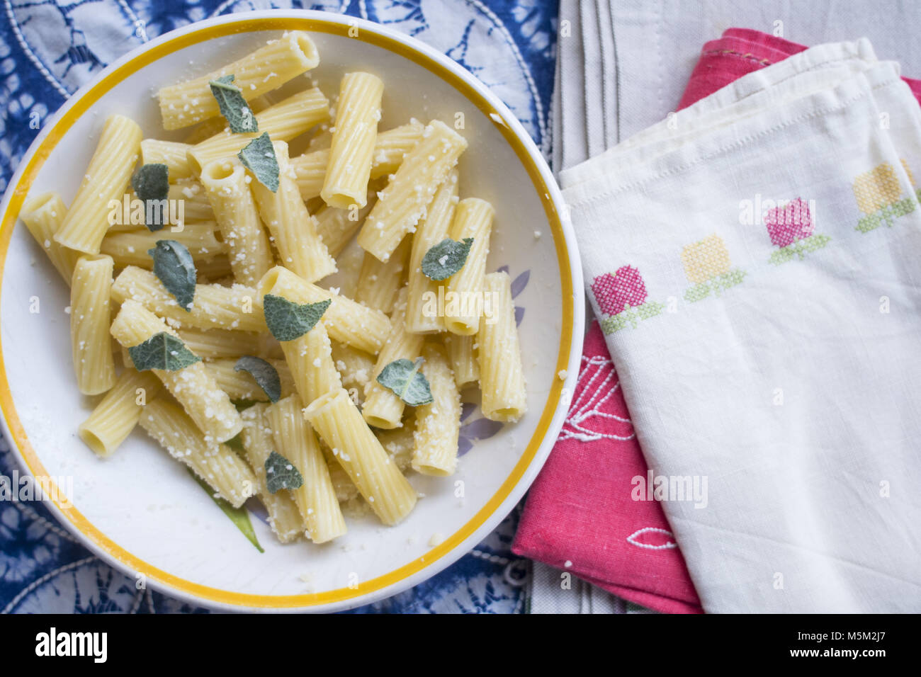 dish of rigatoni pasta with butter sage and parmesan Stock Photo - Alamy