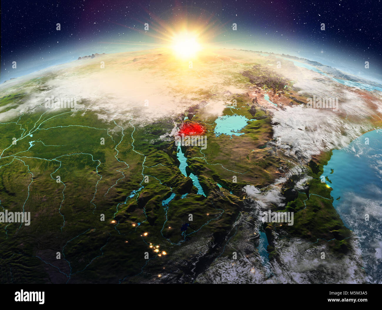 Satellite view of Rwanda highlighted in red on planet Earth with clouds ...