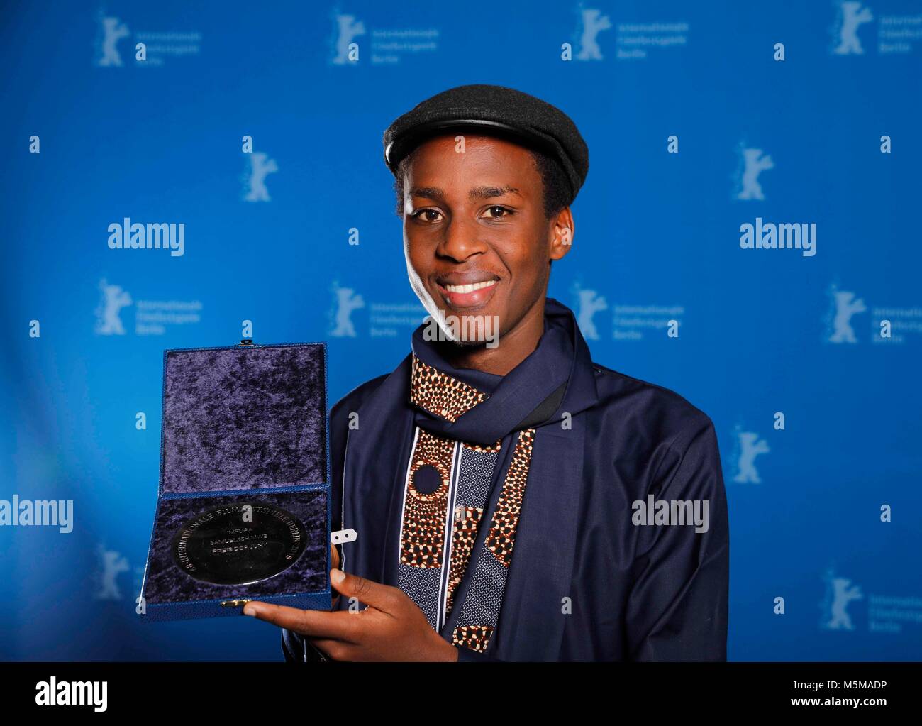 Berlin, Germany. 24th Feb, 2018. Samuel Ishimwe holds the Silver Bear for the short film 'Imfura ...