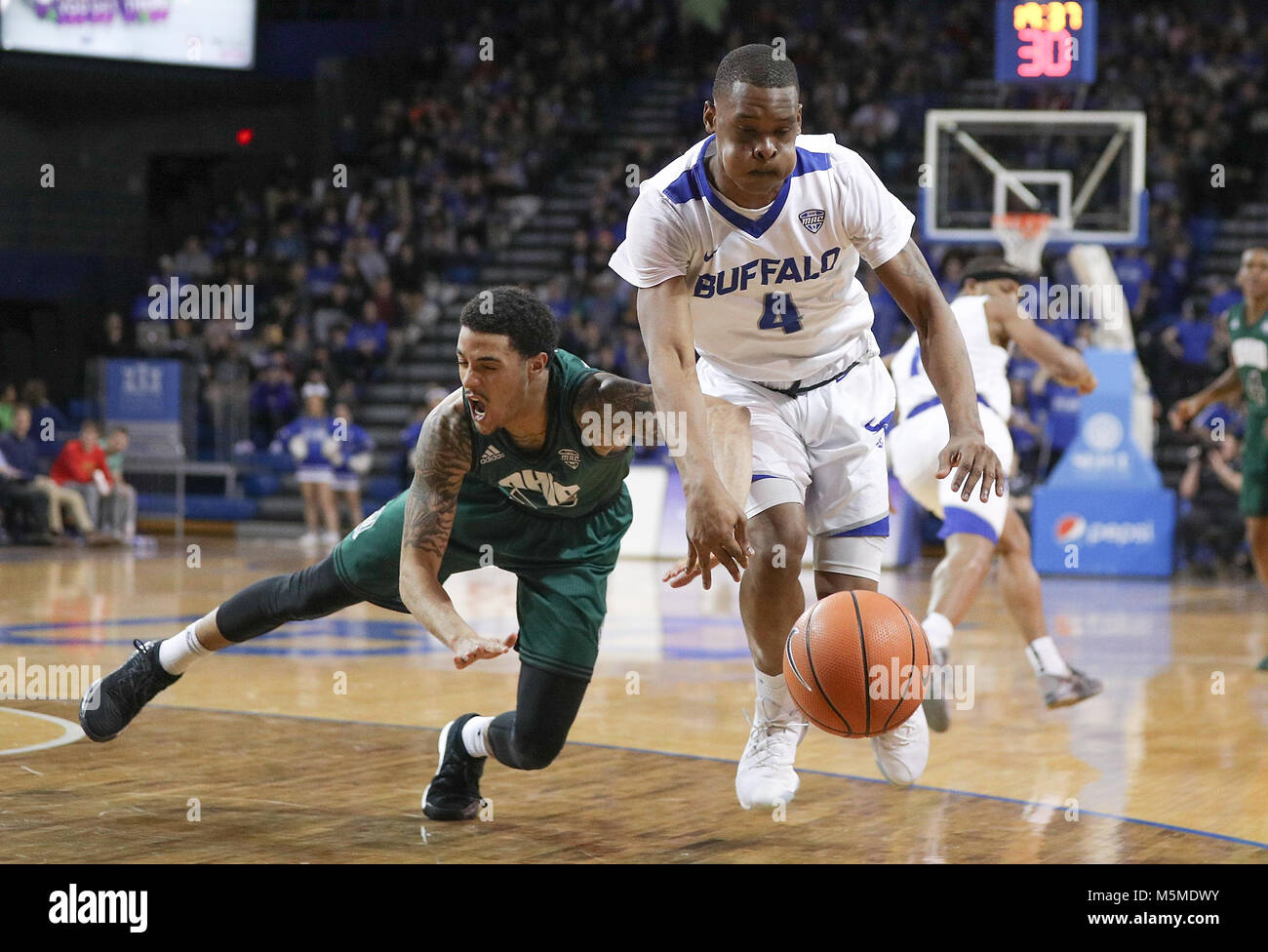 February 24, 2018: Ohio Bobcats guard Jordan Dartis (35) dives for a ...